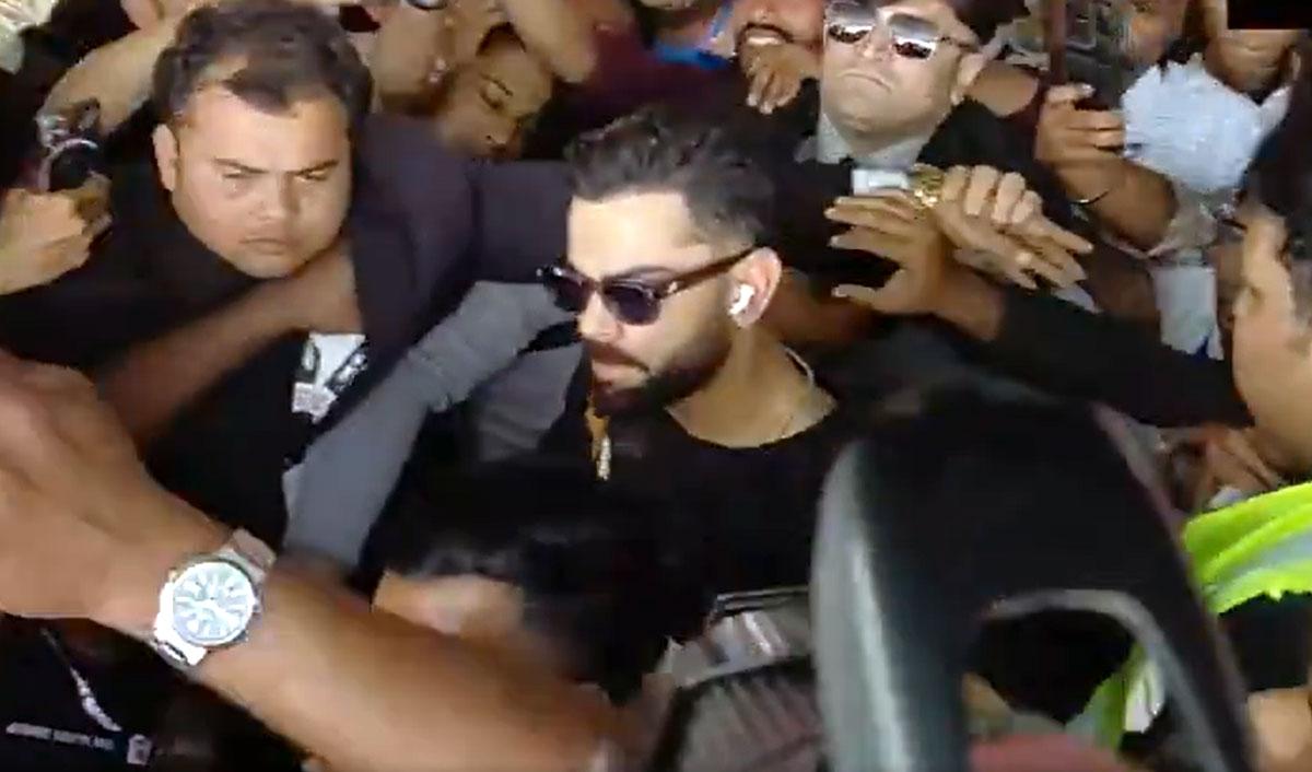 Fans Swarm Virat Kohli At Vadodara Airport | Rediff-TV | Rediff.com