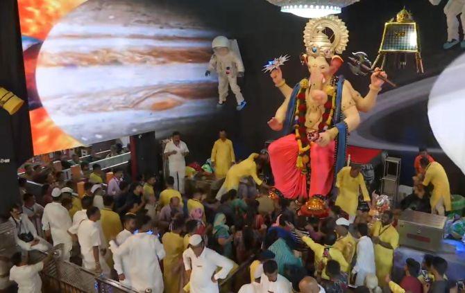 Devotees offer prayers at Lalbaugcha Raja pandal