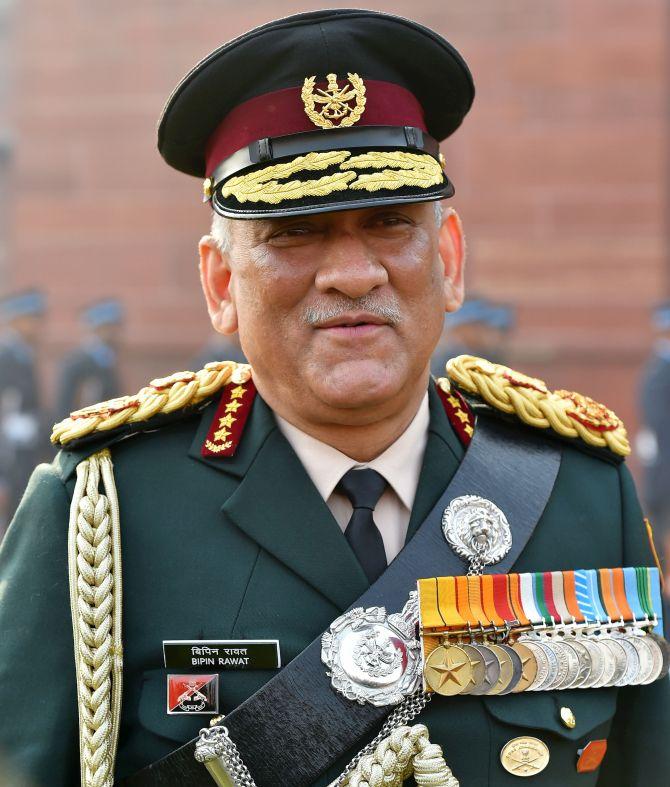 With new peak cap, badges, Gen Rawat makes debut as CDS - Rediff.com ...