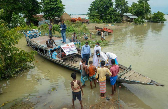 PHOTOS: Floods in Assam affect over 56 lakh, 102 dead - Rediff.com ... PHOTOS: Floods in Assam affect over 56 lakh, 102 dead - Rediff.com ...