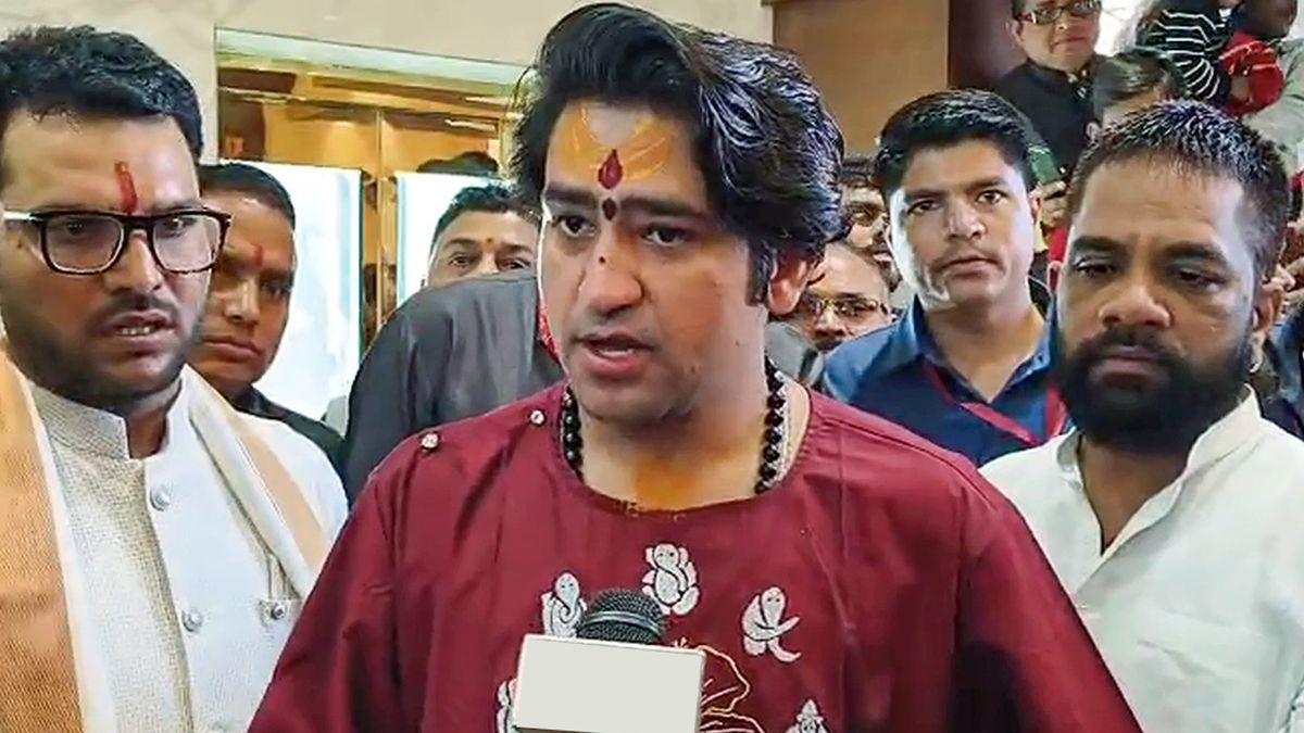 Video of cop touching Dhirendra Shastri's feet sparks row | Rediff-TV ...