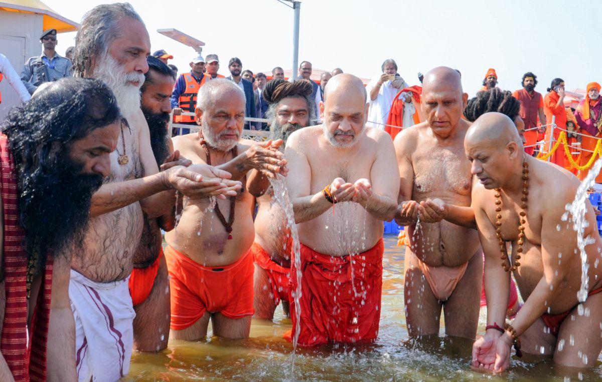 Shah takes holy dip in Triveni Sangam at Maha Kumbh - Rediff.com India News