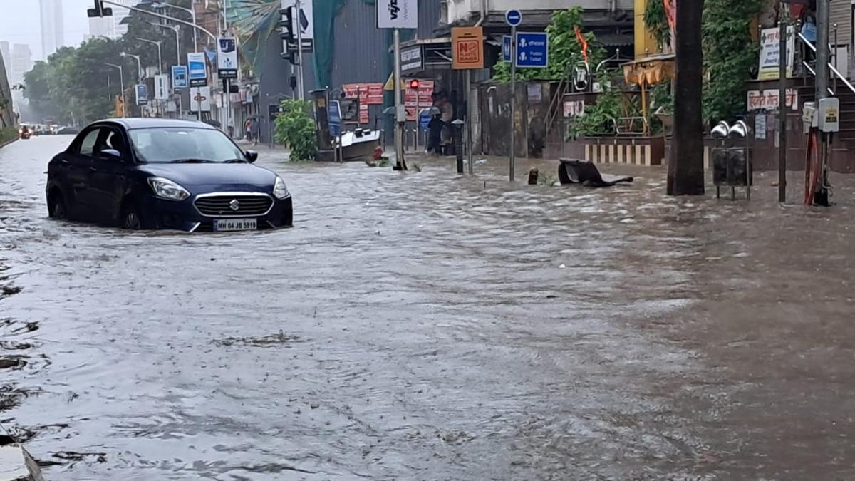 Roads waterlogged, trains delayed as heavy rains disrupt Mumbai - Rediff.com India News