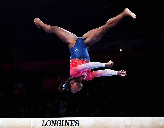 Biles rewrites history as US romp to fifth straight World title ...