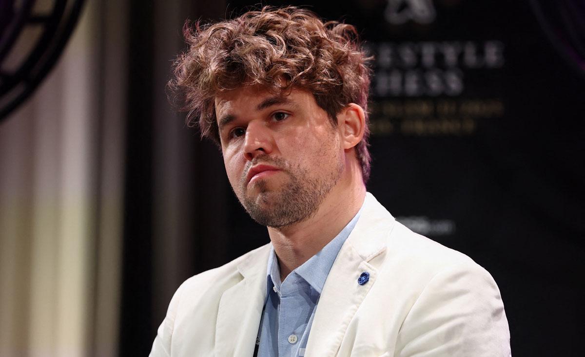 Angry Carlsen pushes away camera after shock loss | Rediff-TV | Rediff.com