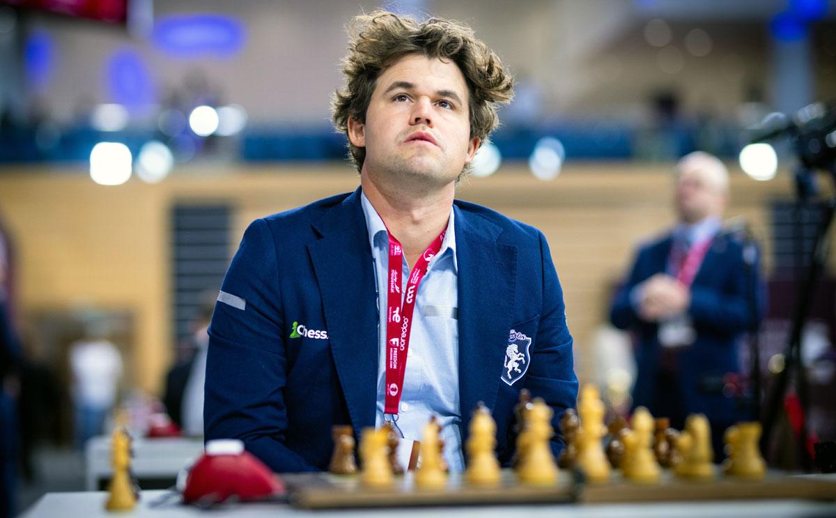 Angry Carlsen pushes away camera after shock loss | Rediff-TV | Rediff.com